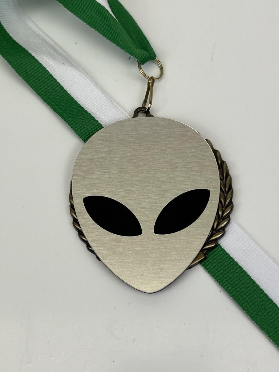 Alien Vector Cut Logo Medal - Schoppy's Since 1921
